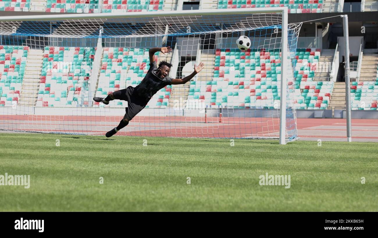 Goalkeeper catches ball stadium hi-res stock photography and images - Alamy