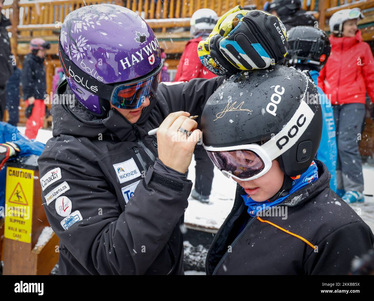 Canada's Brodie Seger, left, signs a fans helmet after the men's World ...