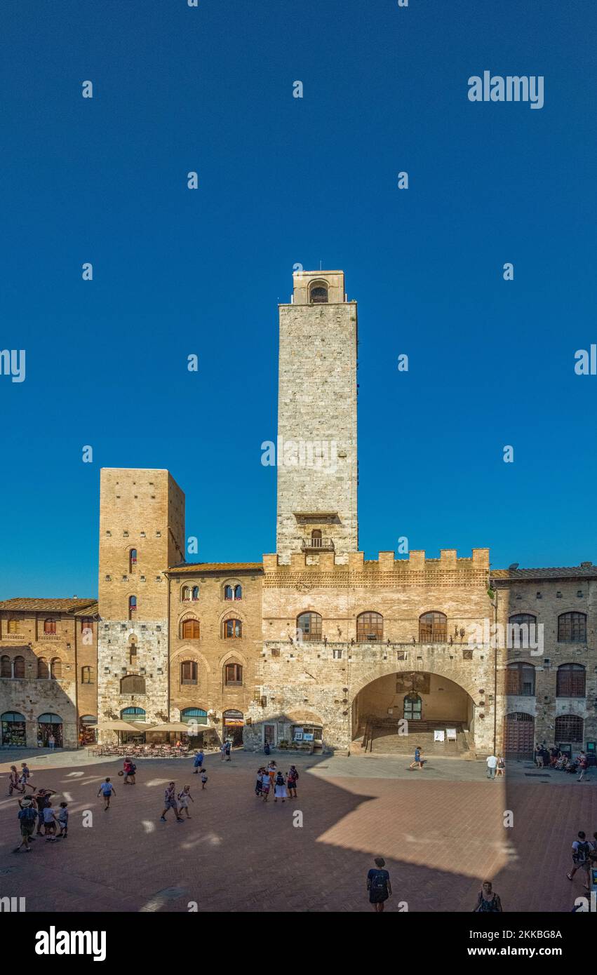 San Gimignano, Tuscany, Italy - August 9, 2019: Old medieval square and ...
