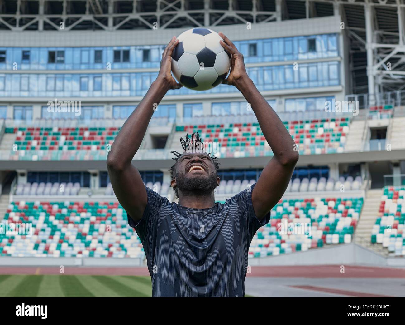 Hands holding football hi-res stock photography and images - Alamy