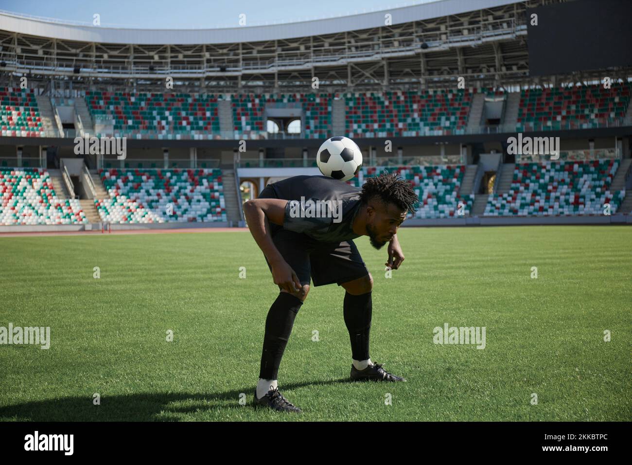 one football player is training holding the ball with his back Stock ...