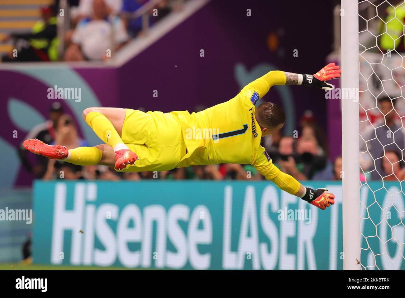 Al Khor, Qatar. 25th Nov, 2022. Jordan Pickford of England dives to ...