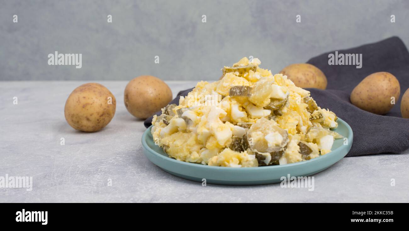Potato salad on a plate, traditional german party food with eggs ...