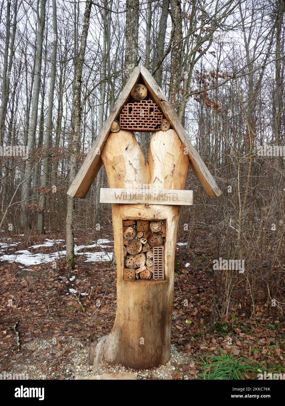 A wild bee hotel at the edge of forest (Translated letters in German on ...