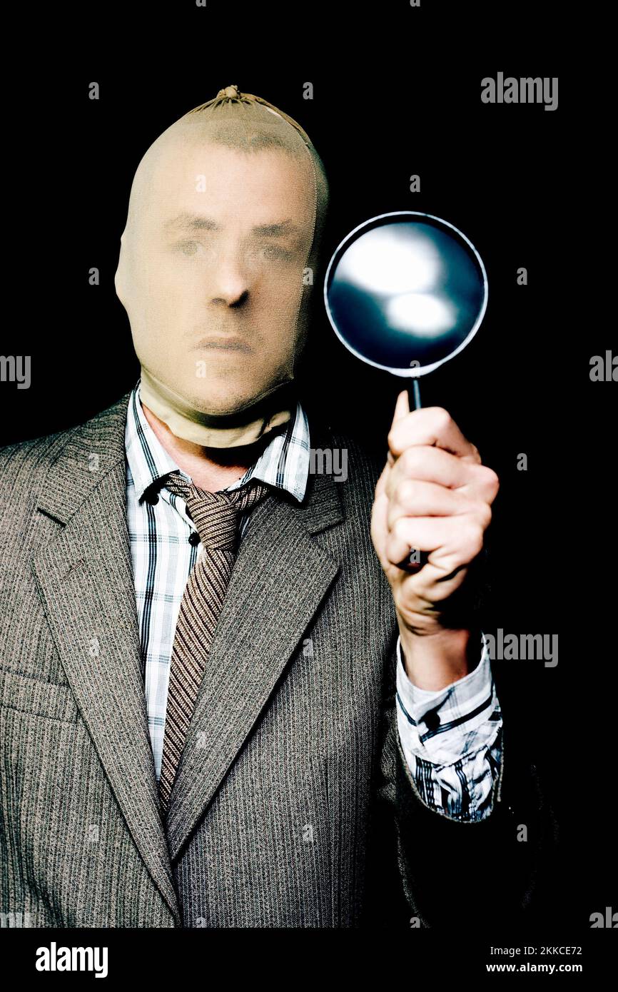 Masked man in a business suit hi-res stock photography and images - Alamy