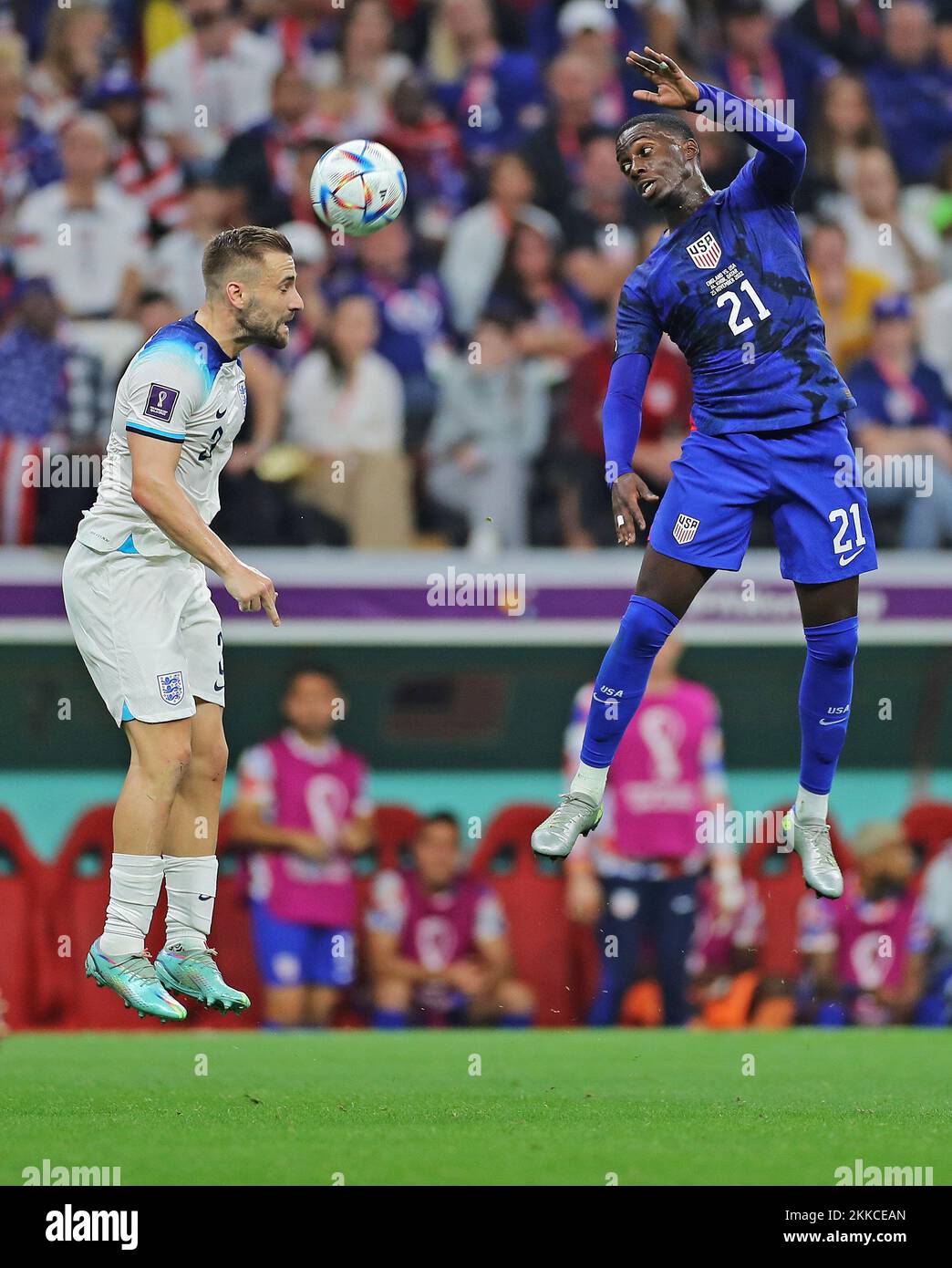 Doha, Qatar. 25th Nov, 2022. Luke Shaw of England competes with Timothy ...