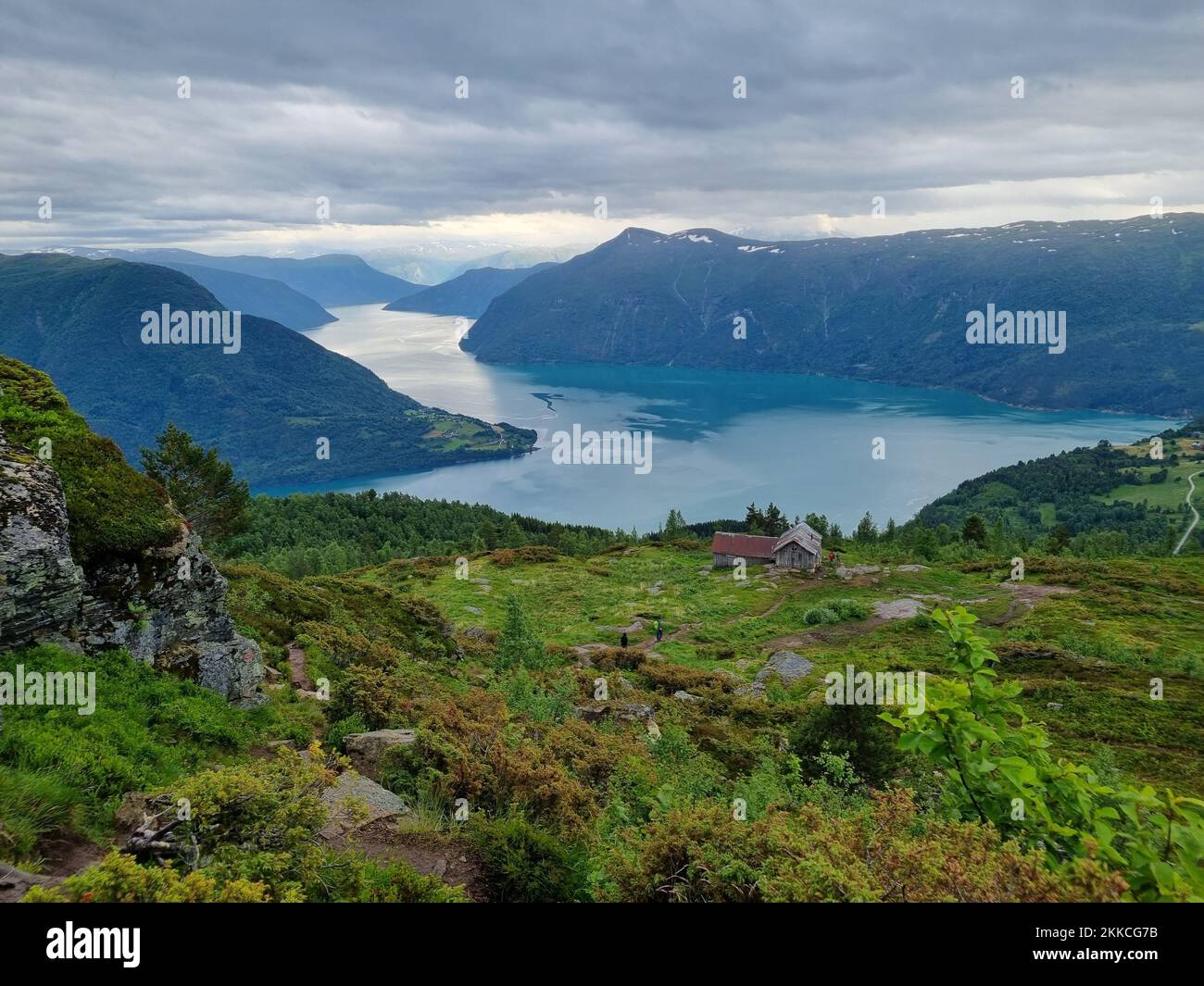 A beautiful shot of a river between mountains on a cloudy day Stock ...