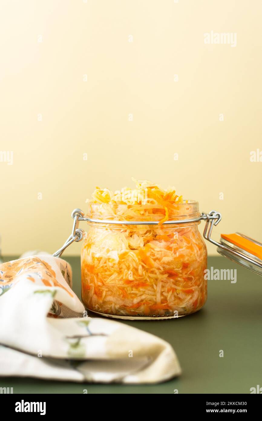 Fresh fermented vegetables, fermented cabbage with carrots in a glass ...
