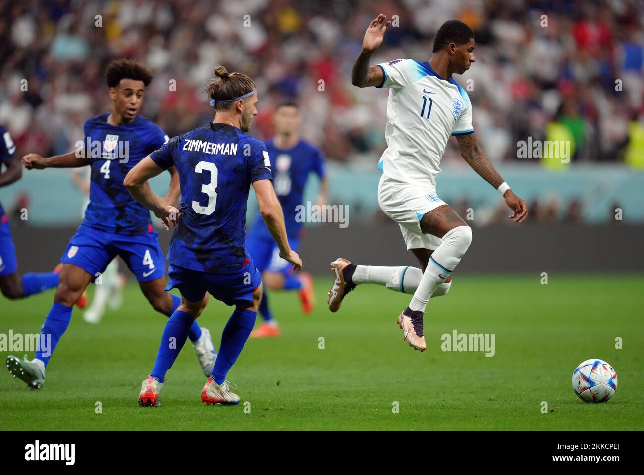 England's Marcus Rashford (right) gets past USA's Antonee Robinson and ...