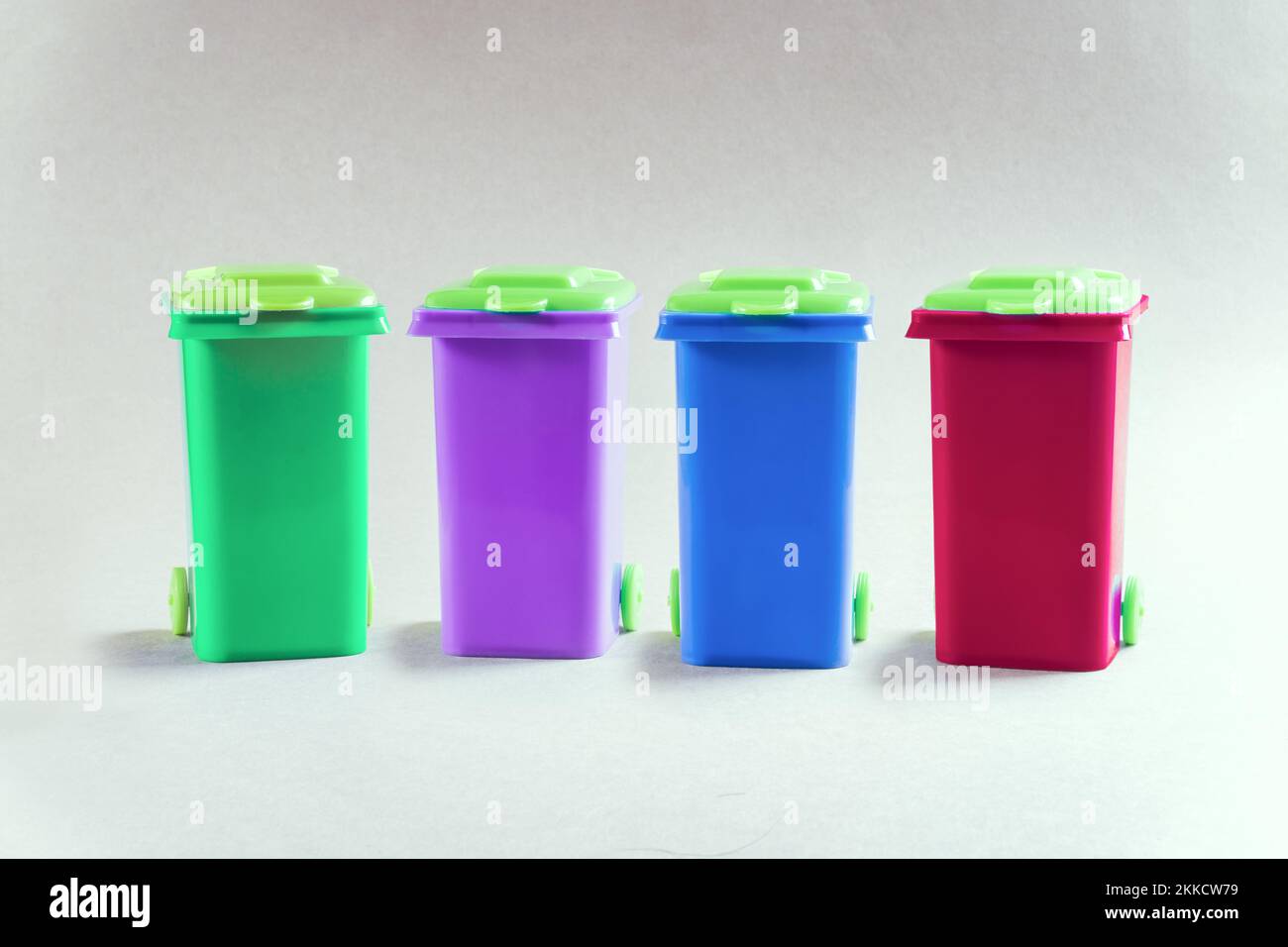 Multicolored toy plastic bins for different waste types, separate ... Multicolored toy plastic bins for different waste types, separate ...