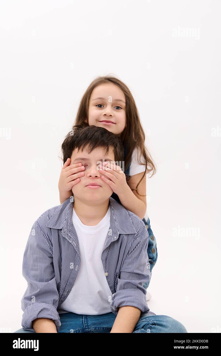 Charming little girl - loving sister hugging her brother - a teenage ...