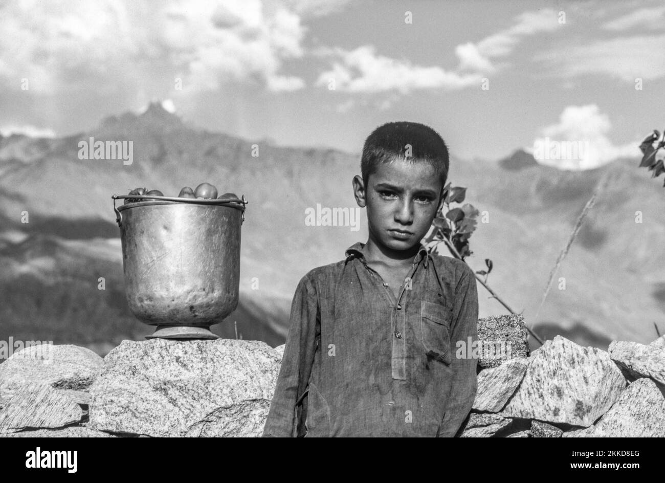 GILGIT, PAKISTAN - JUNE 30, 1986: local farmer boy takes home the ...