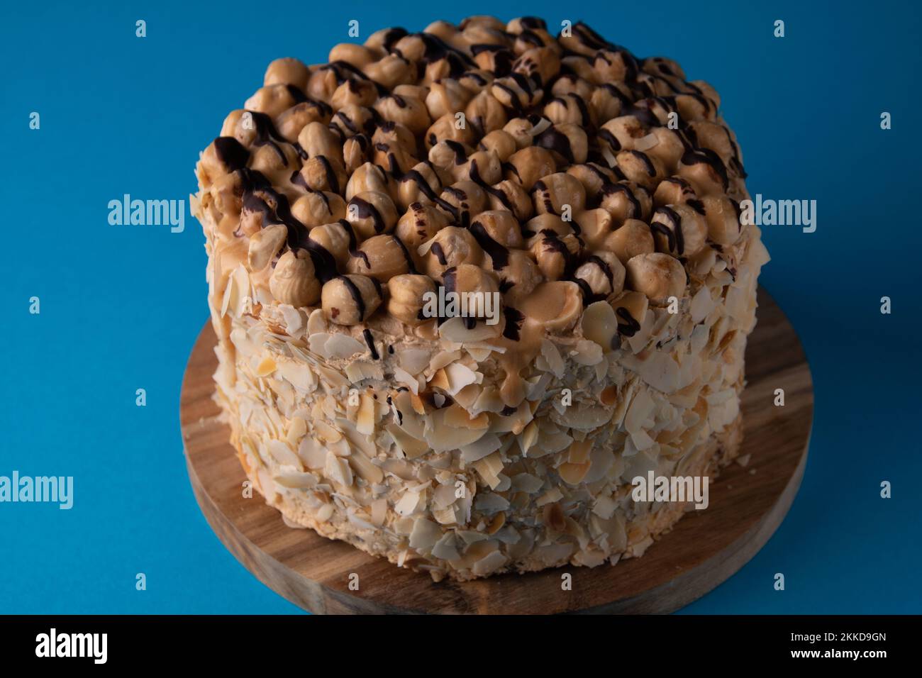 Close-up photo of a whole walnut cake on a blue background Stock Photo ...