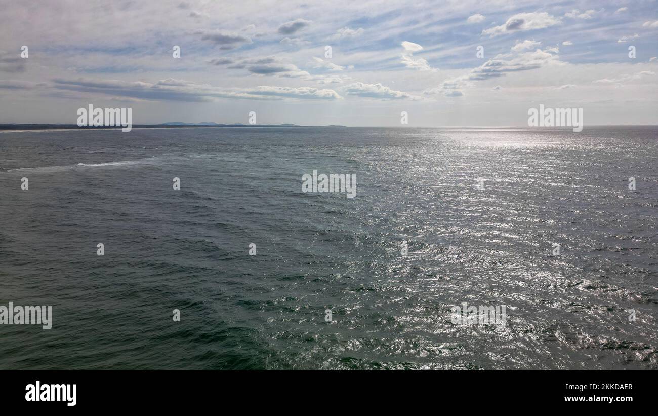 A beautiful view of the gray water surface of the Tasman Sea under the ...