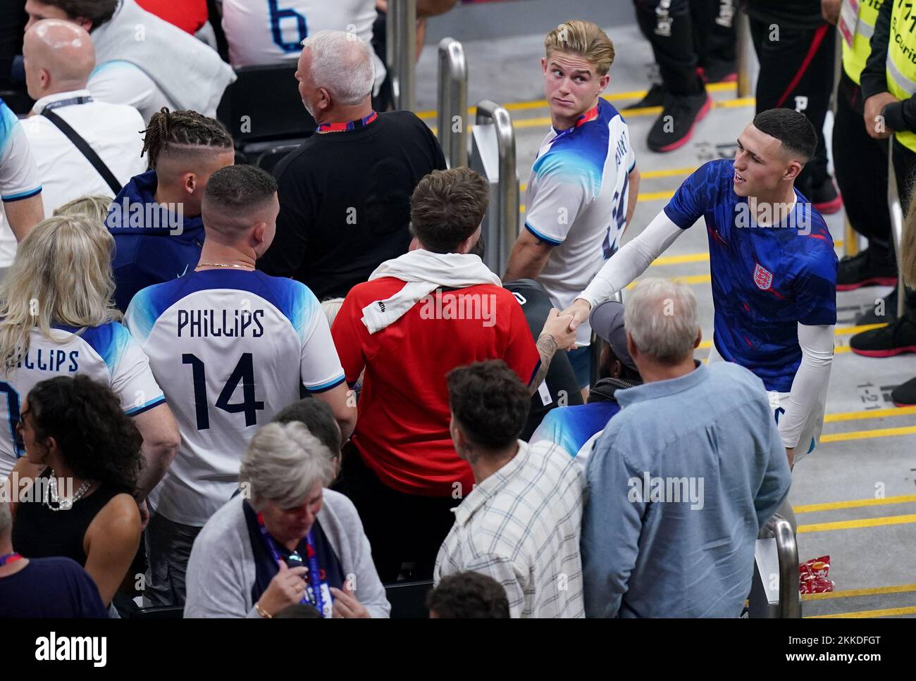 England's Phil Foden (centre) greets friends and family of team-mate ...