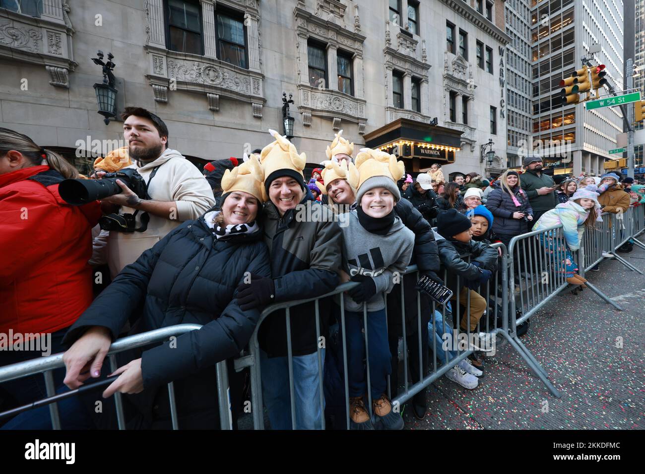 NEW YORK, NEW YORK - November 24, 2022: People watch festivities on the ...