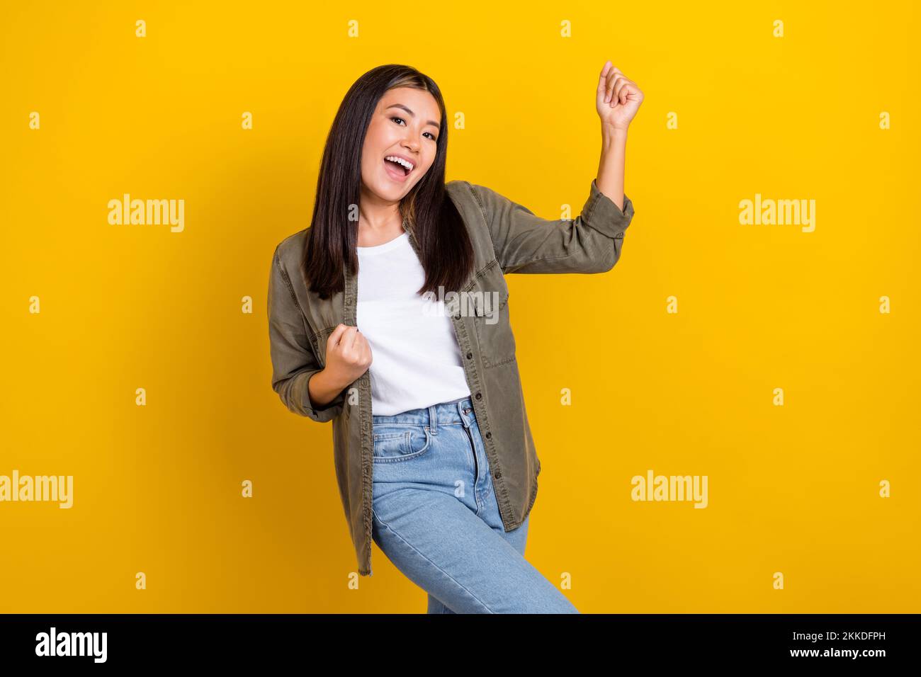 Photo of young korean girl raise fists up first place winner ...