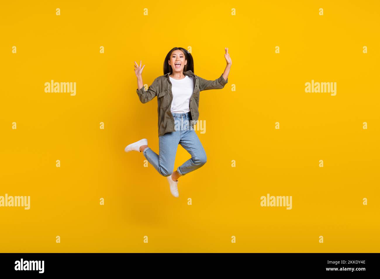 Full body length photo of young smiling chinese woman celebrate hands ...