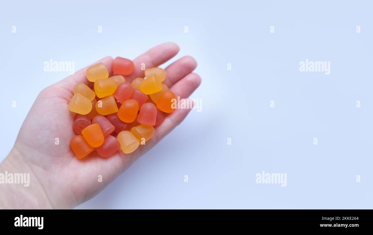 Red multivitamin supplement gummies in hi-res stock photography and ...