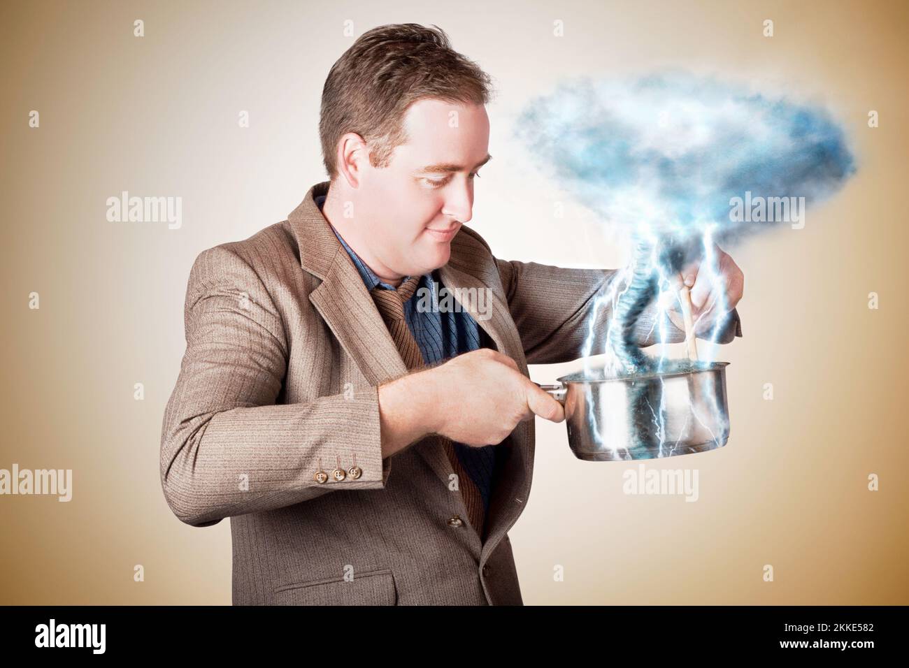 Planning business man standing in kitchen stirring up a storm of clouds ...