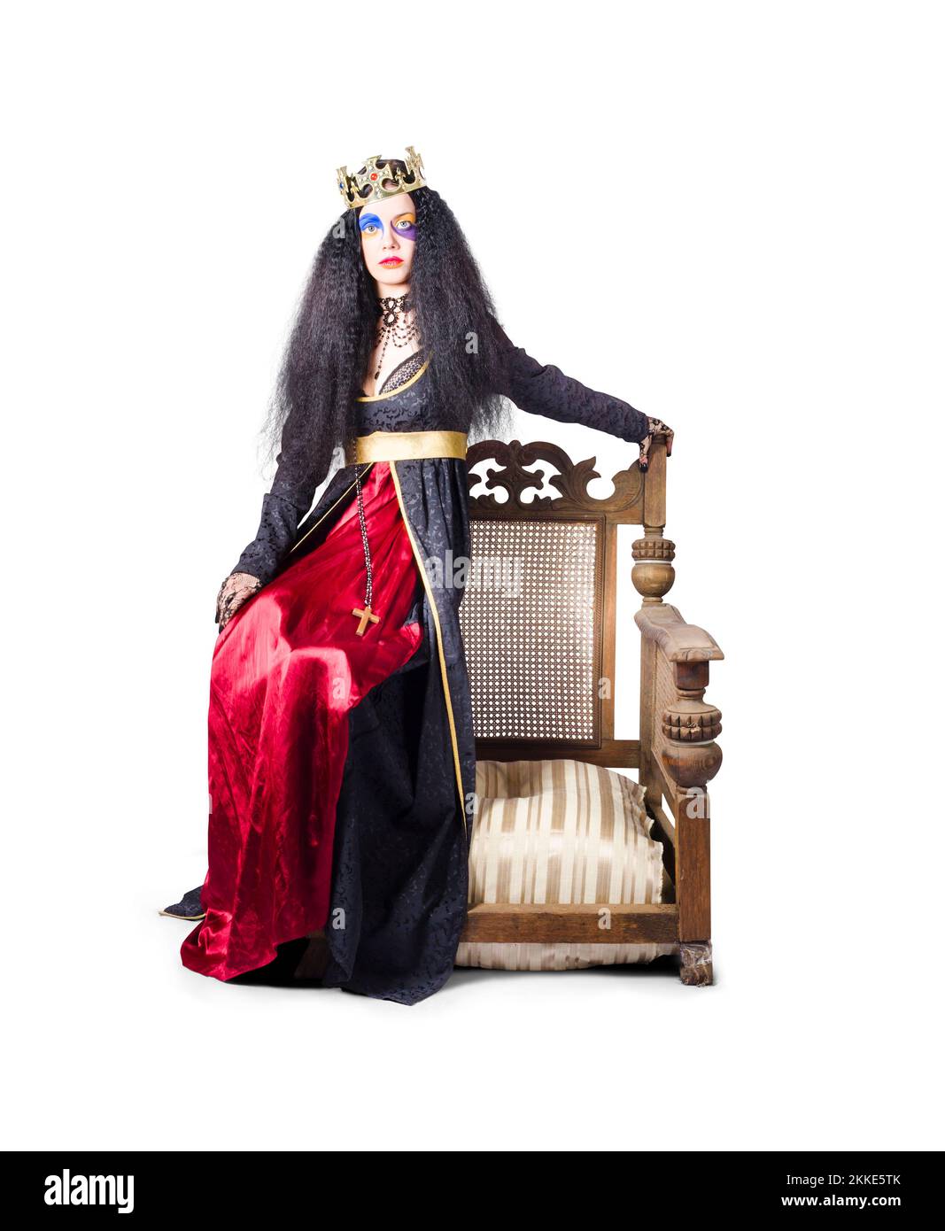 Queen with crown sitting on wooden throne chair, white studio ...