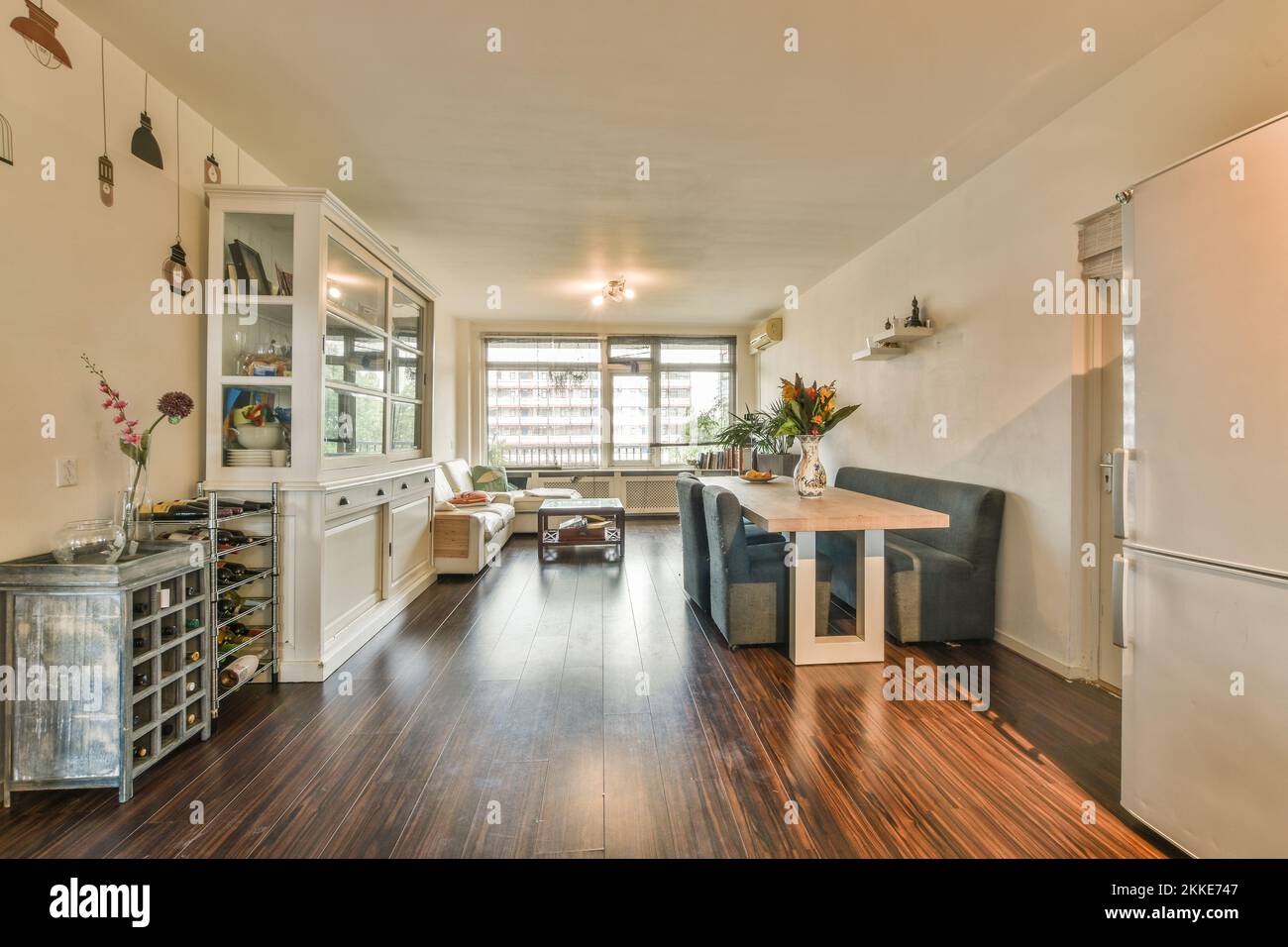 Counter with chairs dividing kitchen with modern furniture from dining ...