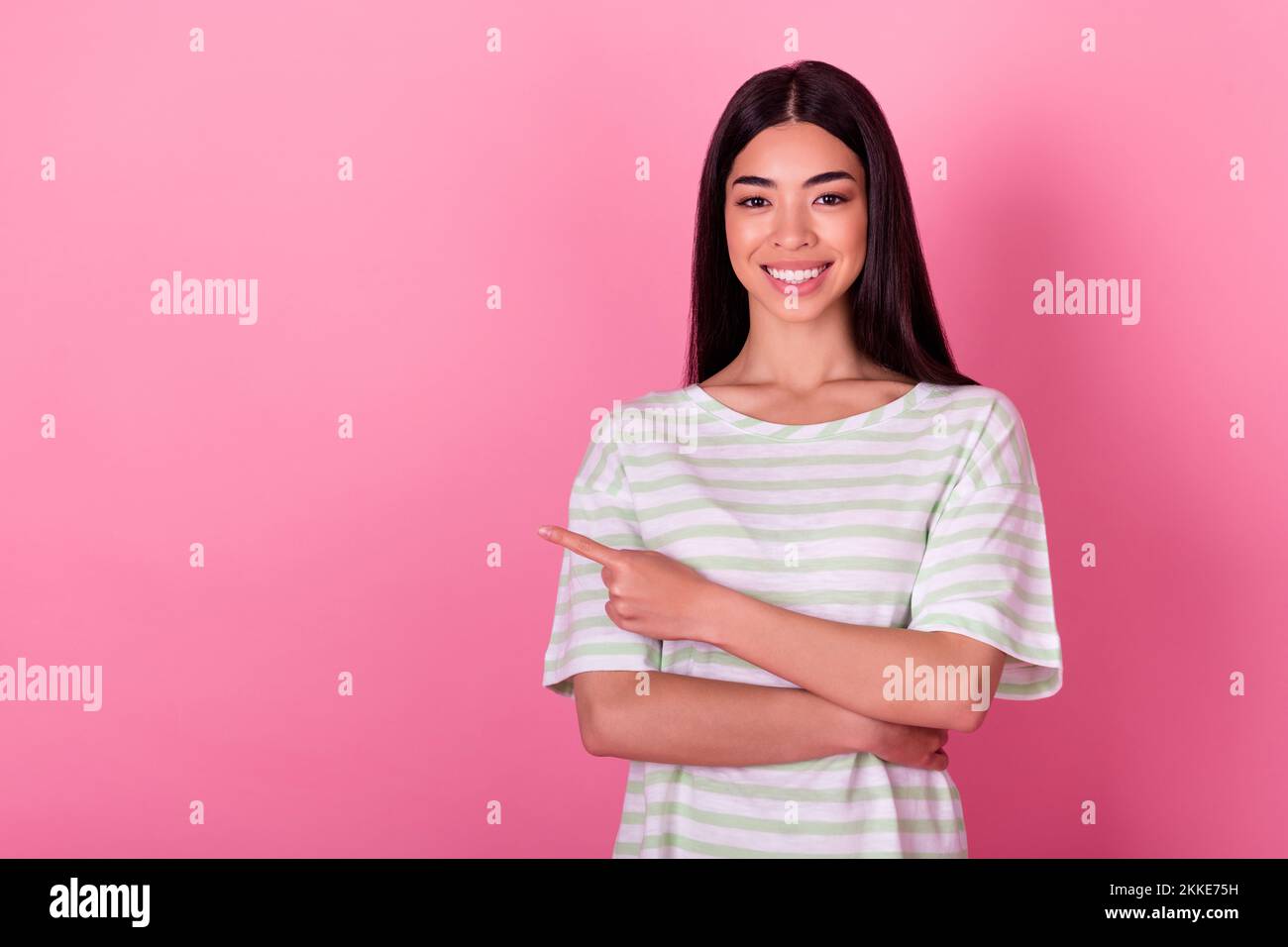 Photo of nice satisfied indonesian lady toothy smile indicate finger ...