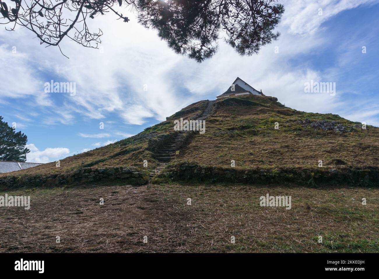 megalithic grave mound named Saint-Michel tumulus near Carnac, Brittany ...