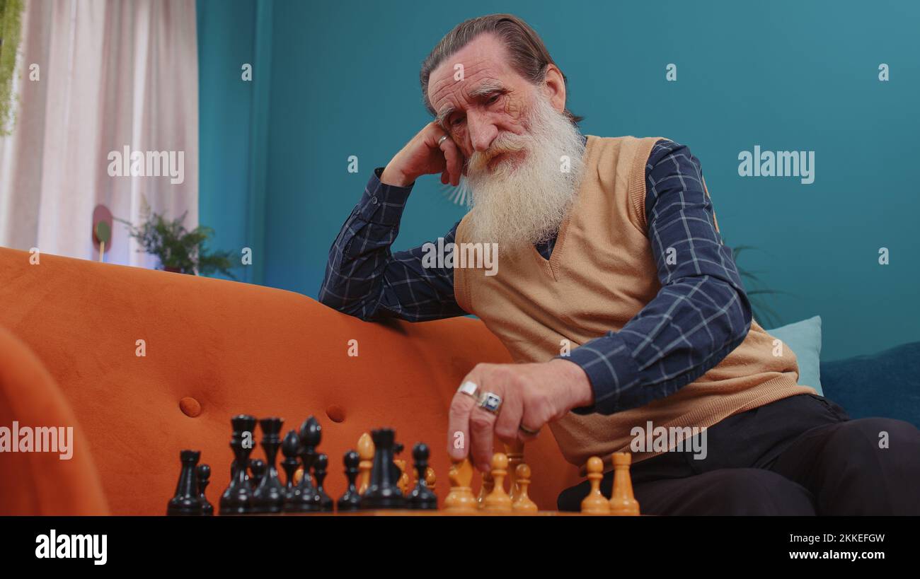 Old man playing chess alone hi-res stock photography and images - Alamy