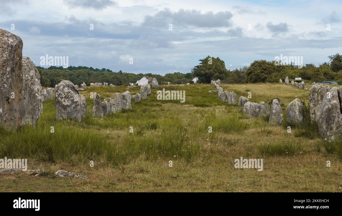 Miles long megalithic stones alignment on green meadow in Carnac ...