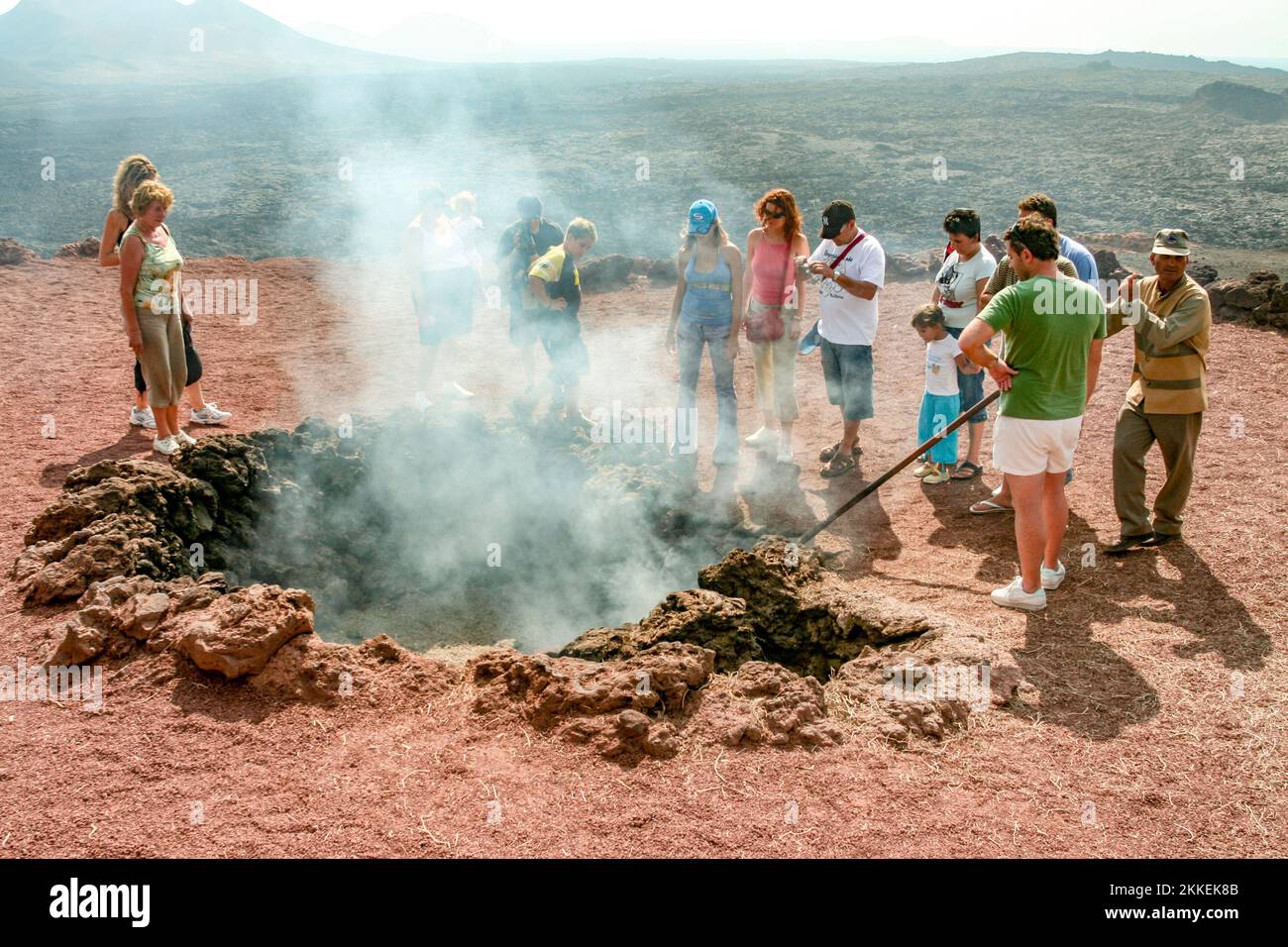 Timanfaya, Spain - August 12, 2006: a guide of the Timanfaya volcanic ...