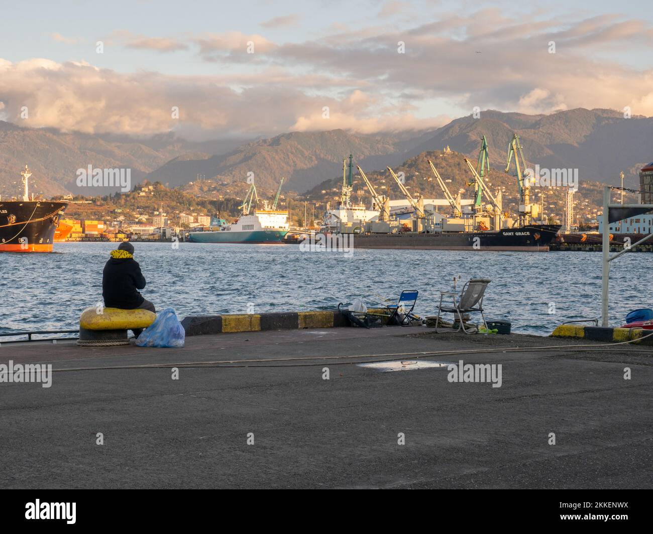 People on the pier by the sea. At the seaport. Hobbies and recreation ...