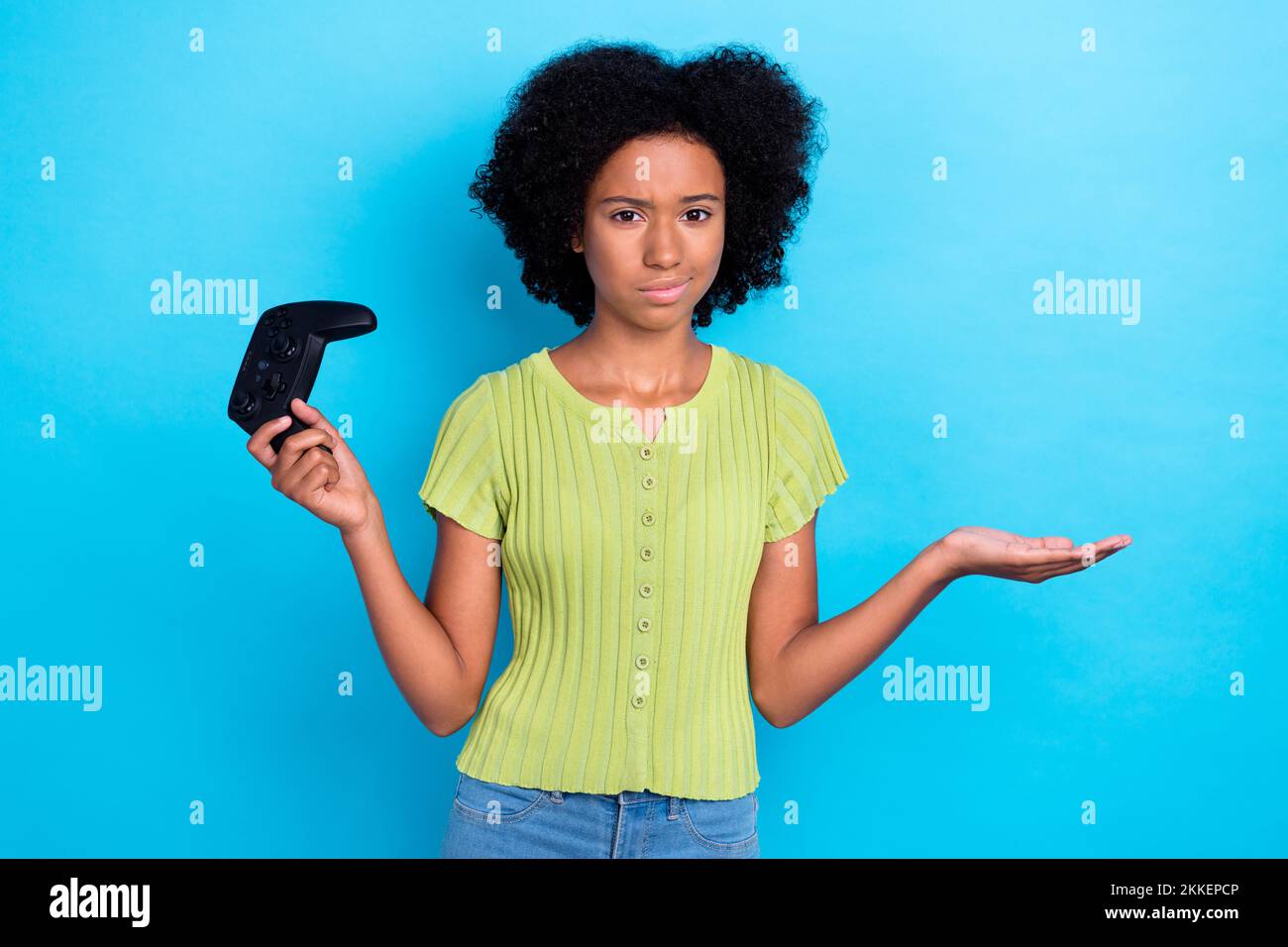 Photo of little funky minded schoolgirl teenager hold palm object for ...