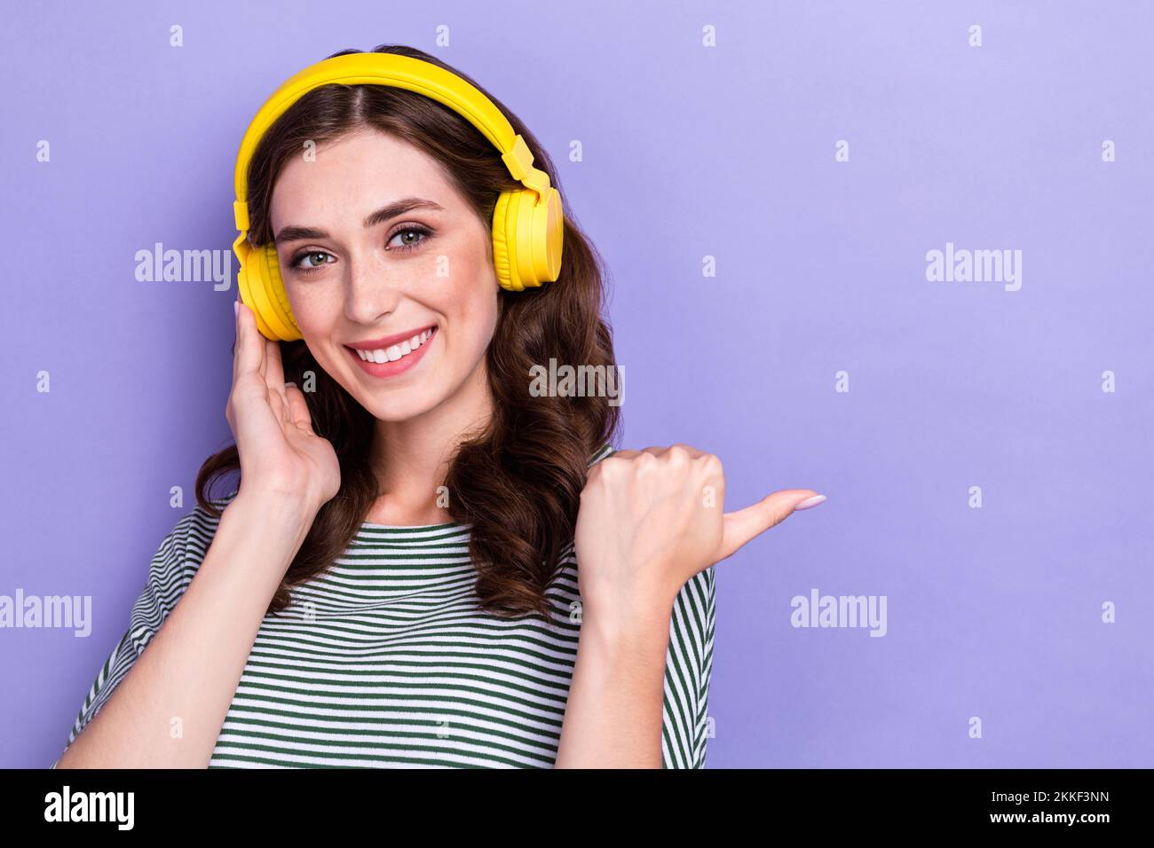 Photo of positive cheerful cute lady arm direct empty space recommend ...