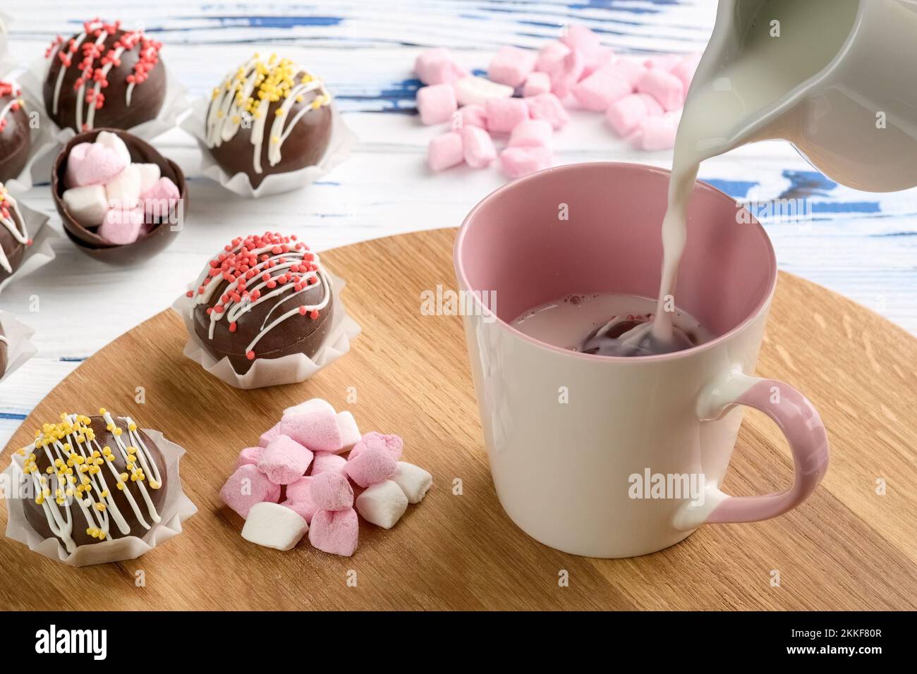 Cocoa bombs are black chocolate shells filled with cocoa powder and ...