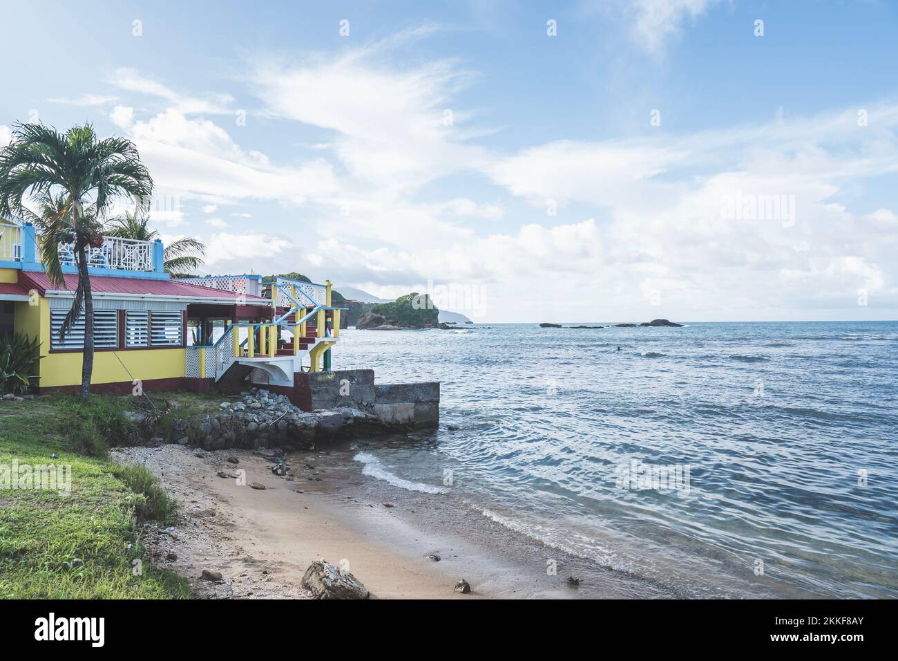 Rocky beach in Dominica, Roseau. Caribbean coastal city with access to ...