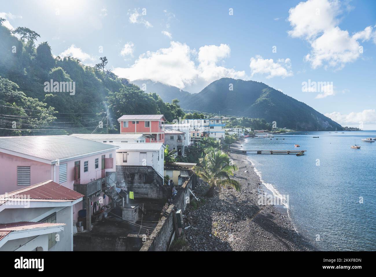 Rocky beach in Dominica, Roseau. Caribbean coastal city with access to ...