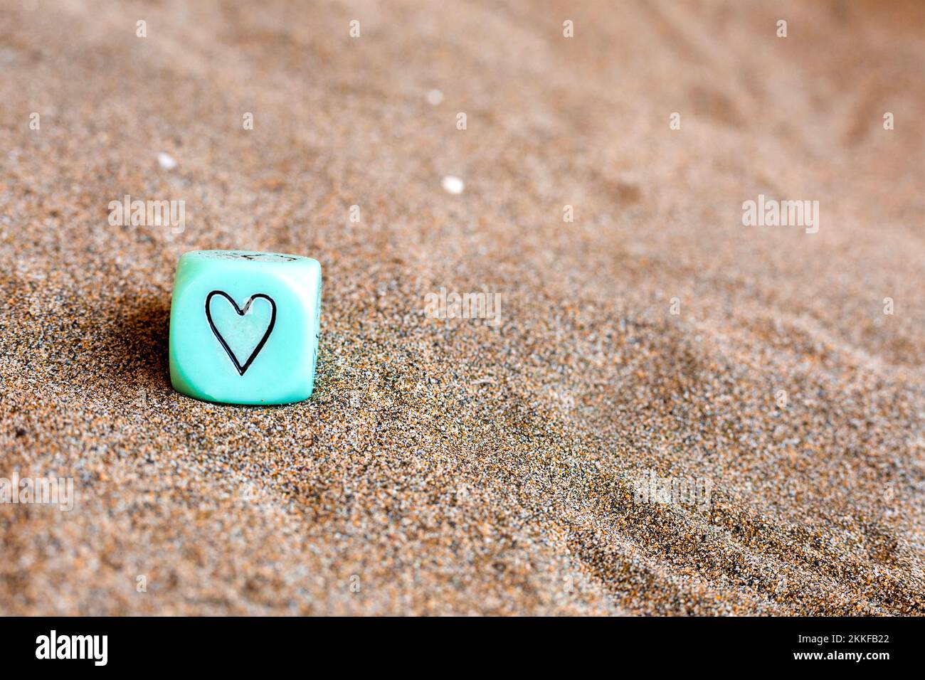 Light blu cube with heart and weather symbols on sides. Funny gambling ... Light blu cube with heart and weather symbols on sides. Funny gambling ...