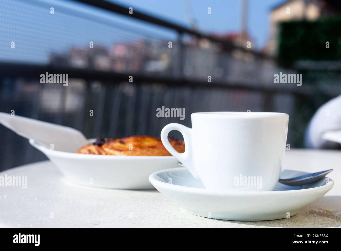 Small white empty cup espresso coffee in bright sunlight. Meditation ...