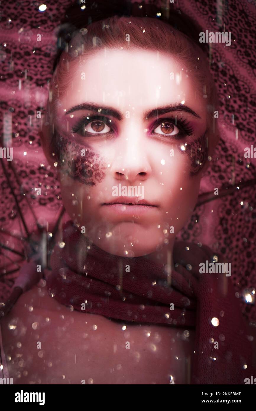 Weather the storm is the face of a woman standing in the rain looking ...
