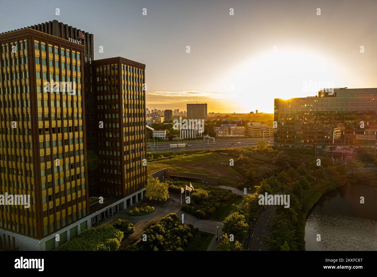 The sunset behind the city buildings Stock Photo - Alamy