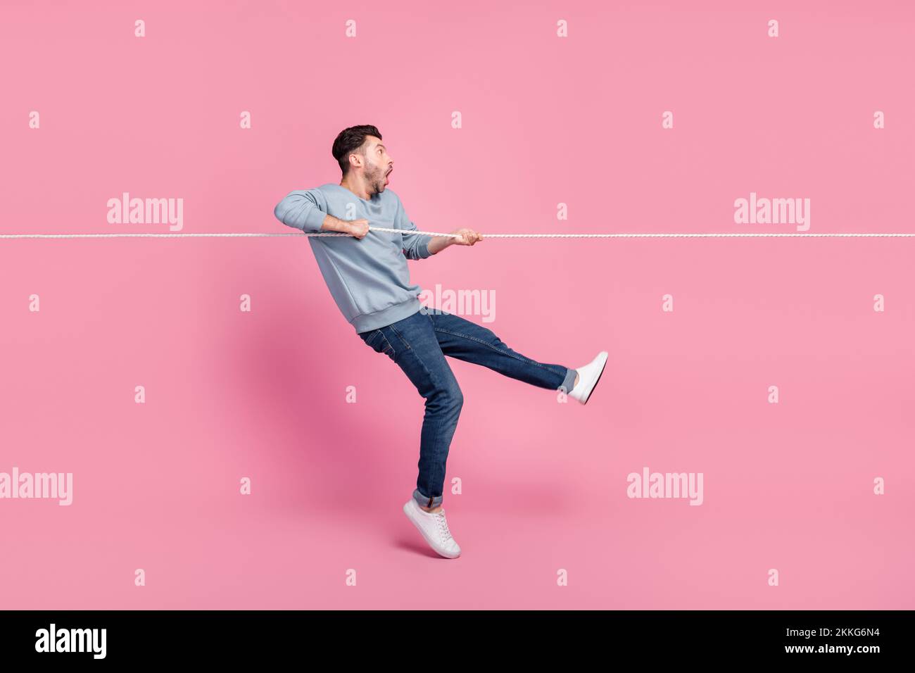 Profile side full size photo of impressed guy pull string see ...