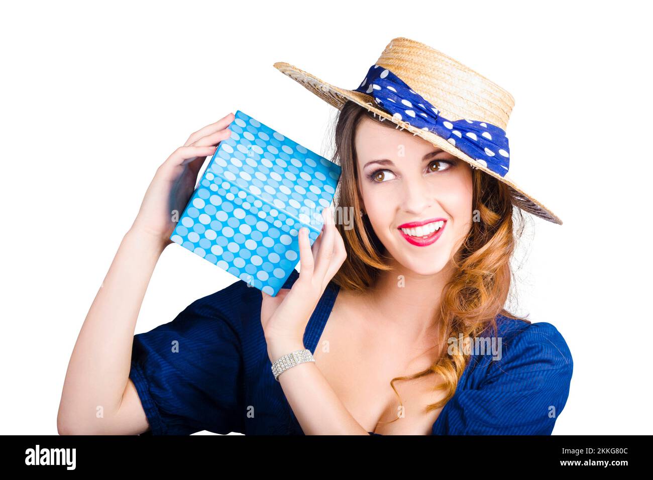 young beautiful pin up woman guessing whats inside a blue polka dot ...