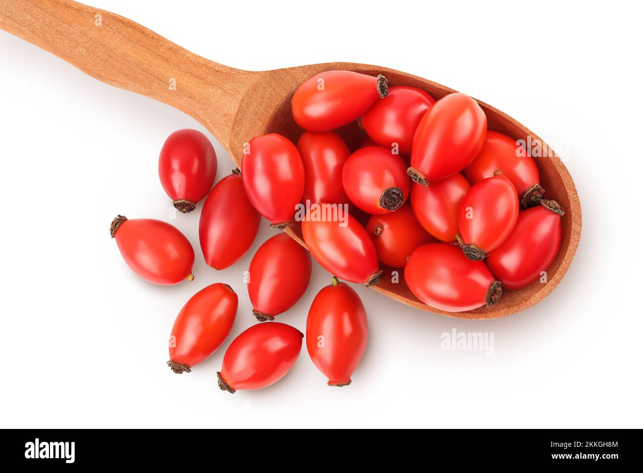 Rose hip in wooden spoon isolated on a white background with full depth ...