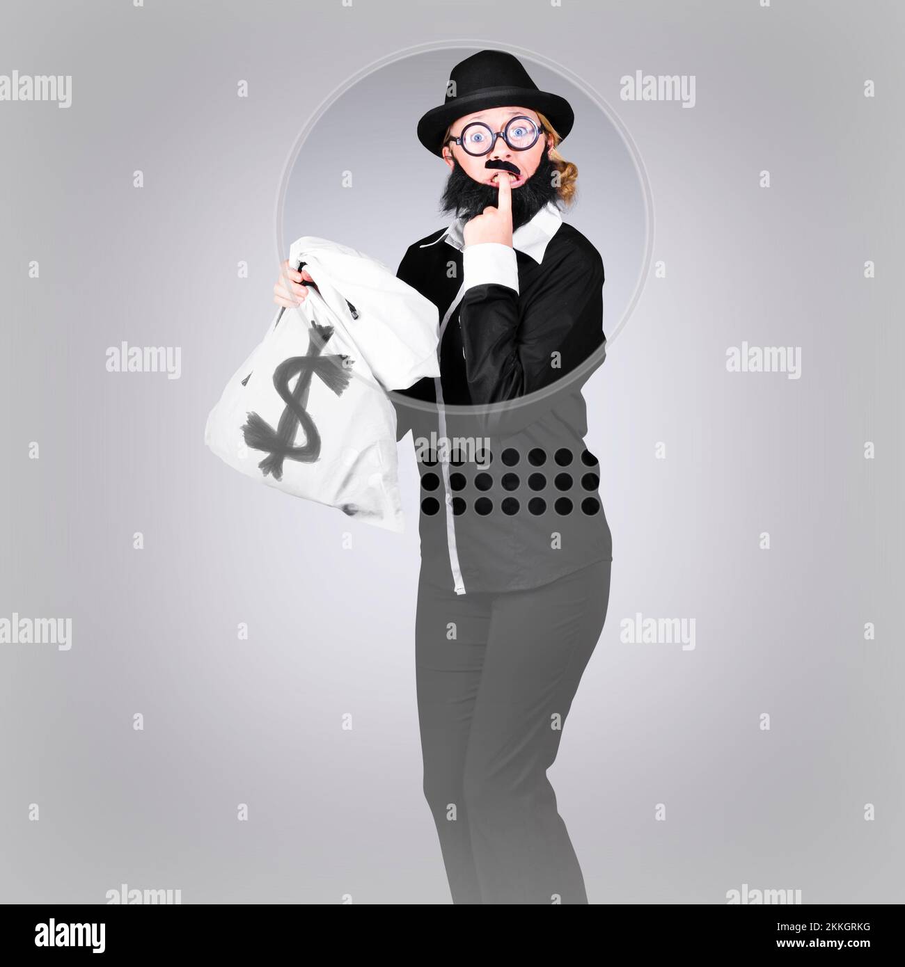 Young business person looking hesitant while holding money at bank ...