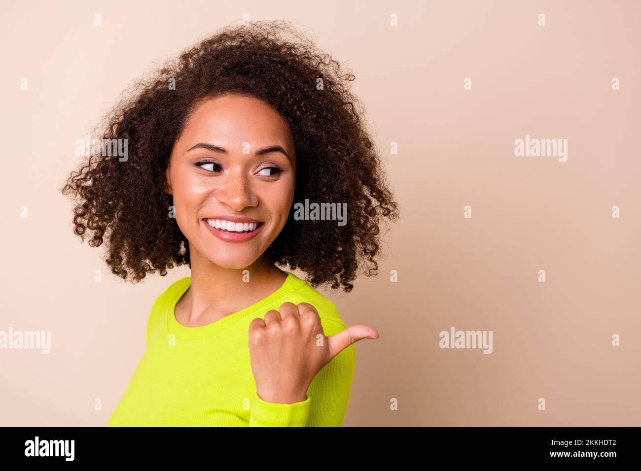 Closeup photo of young gorgeous lady pointing looking empty space nice ...
