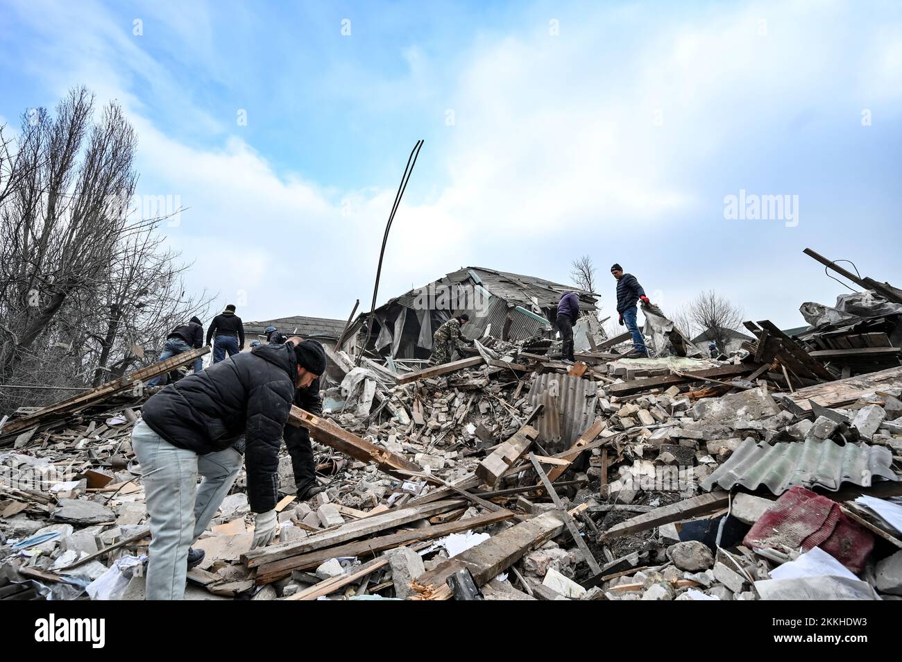 VILNIANSK, UKRAINE - NOVEMBER 23, 2022 - Men remove the rubble at the ...