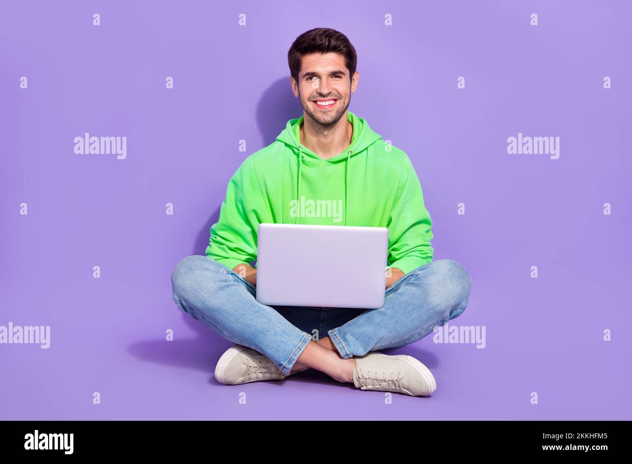 Full length photo of pretty positive man wear green hoodie chatting ...