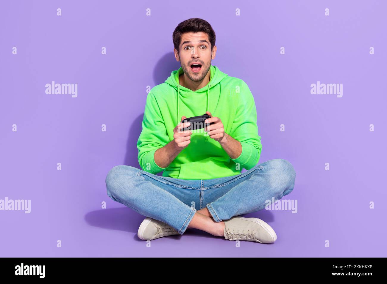 Full length photo of cheerful impressed guy dressed neon sweatshirt ...