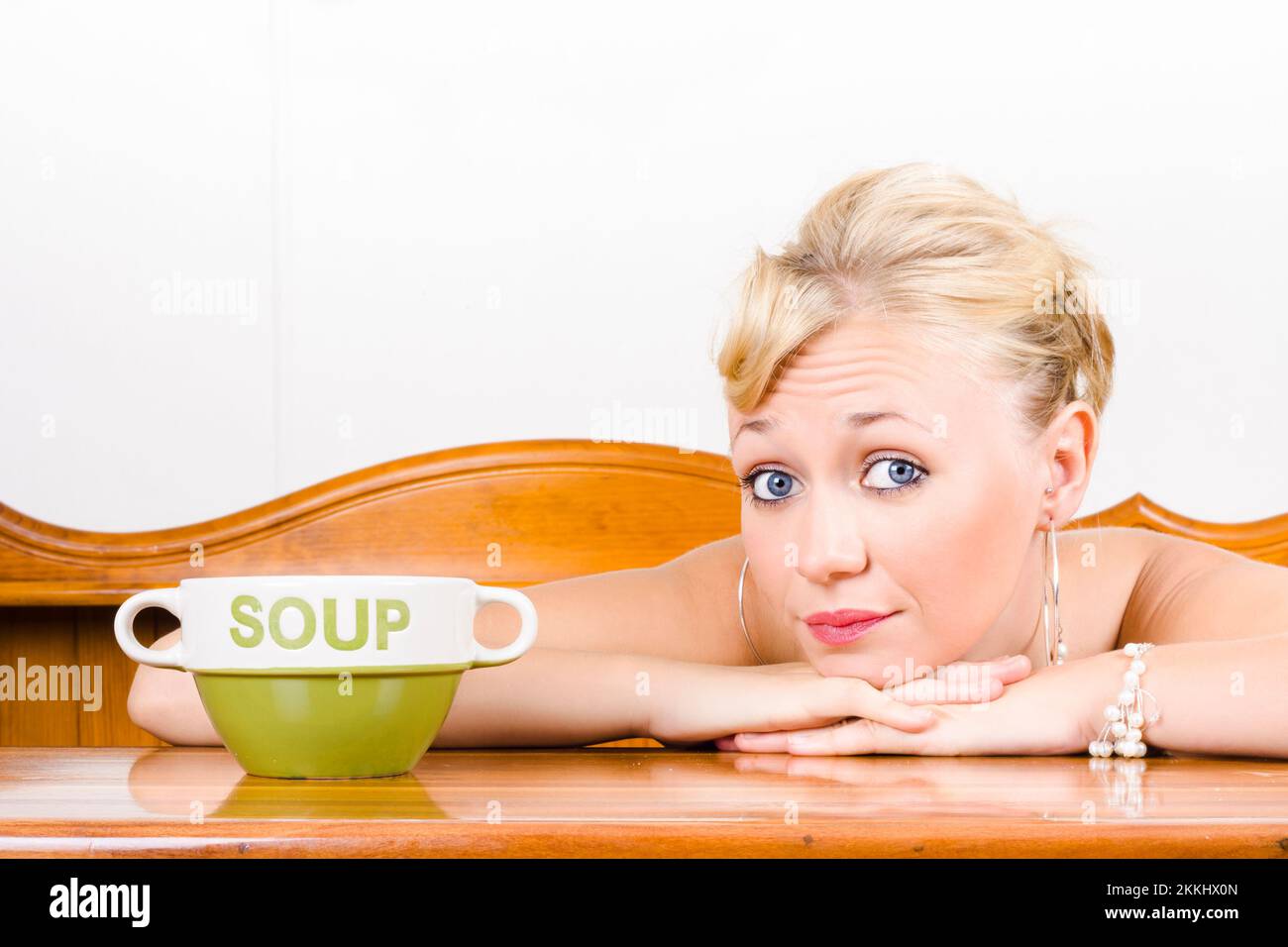 Retro Waiter Collecting Money With Soup Bowl At Restaurant Counter In A Depiction Of Tipping